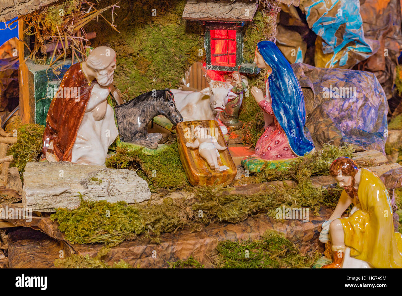 Christmas Nativity scene of baby Jesus in the manger with Saint Joseph ...
