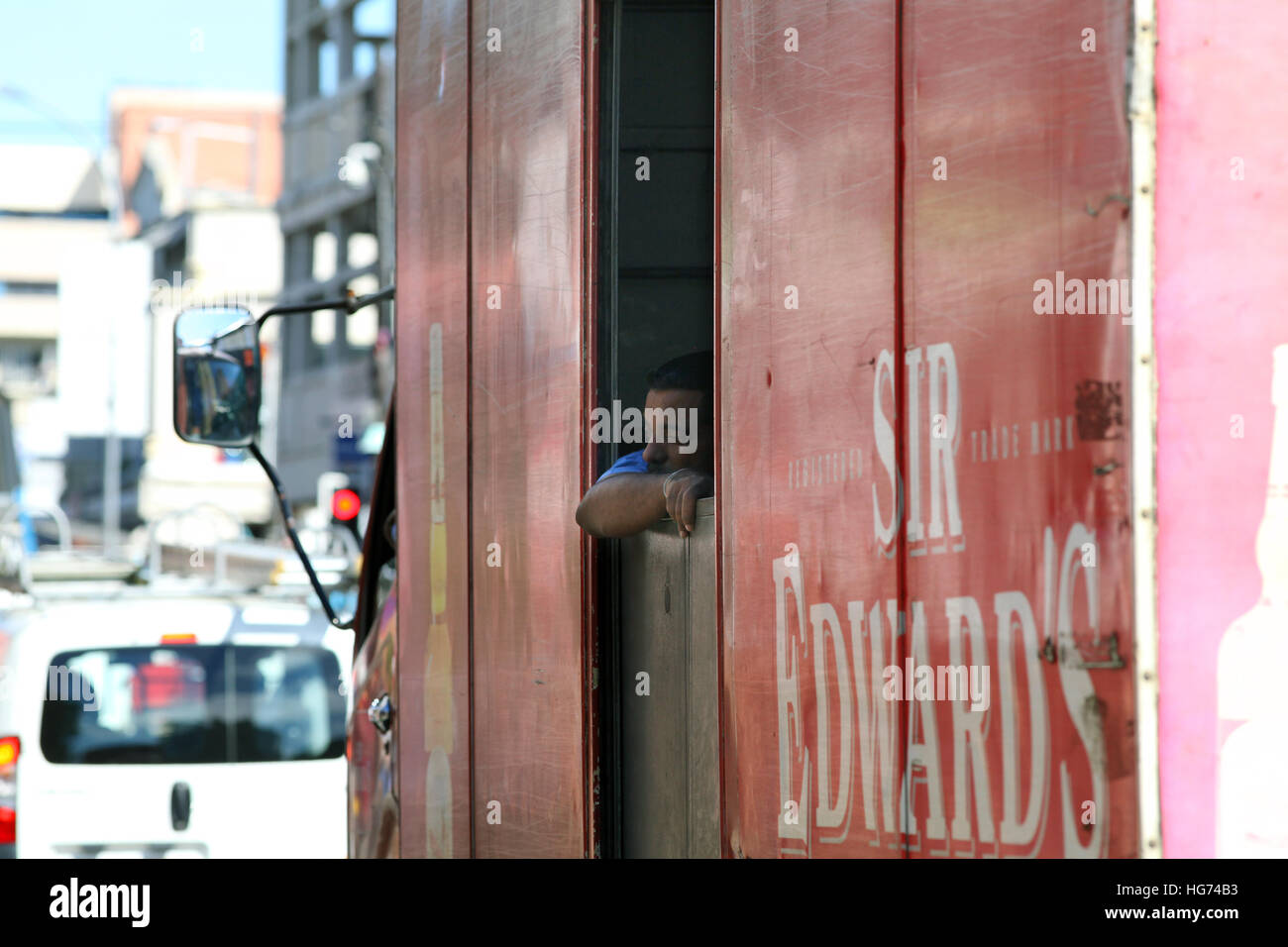 Man in back of van Stock Photo - Alamy