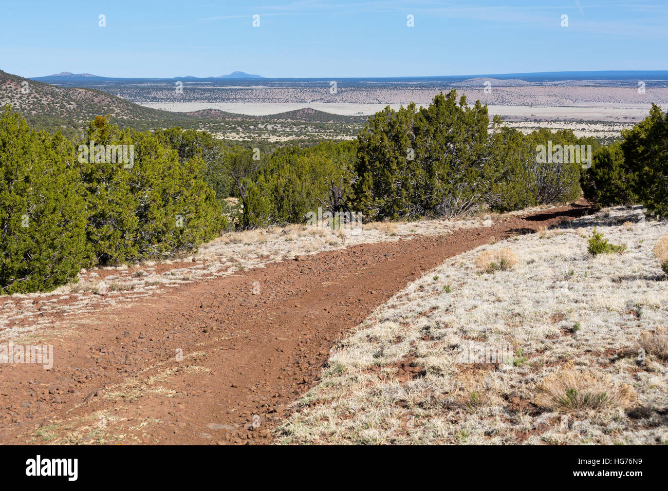 A dirt road heading toward a valley of southwestern prairie north of ...