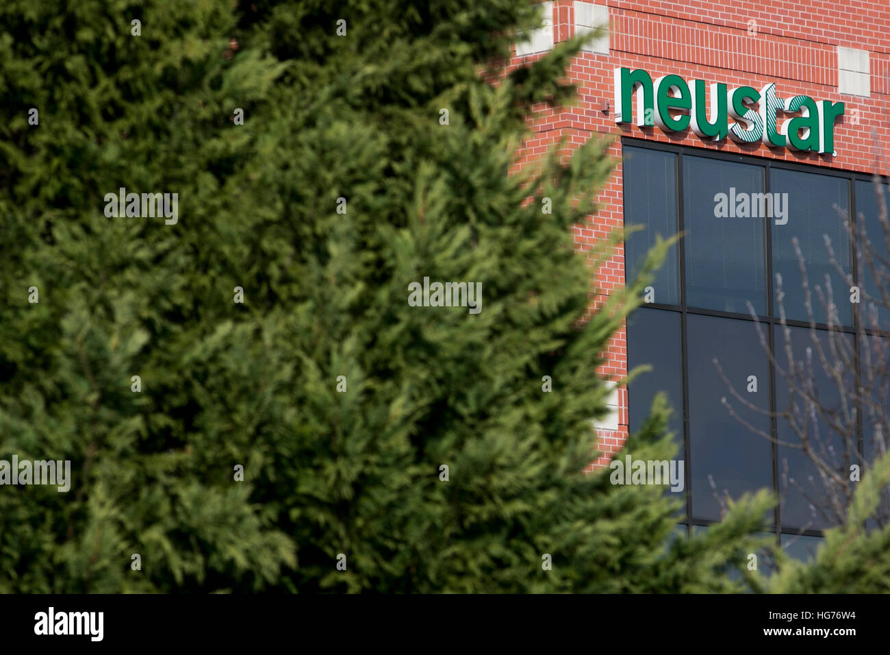 A logo sign outside of the headquarters of Neustar, Inc., in Sterling ...