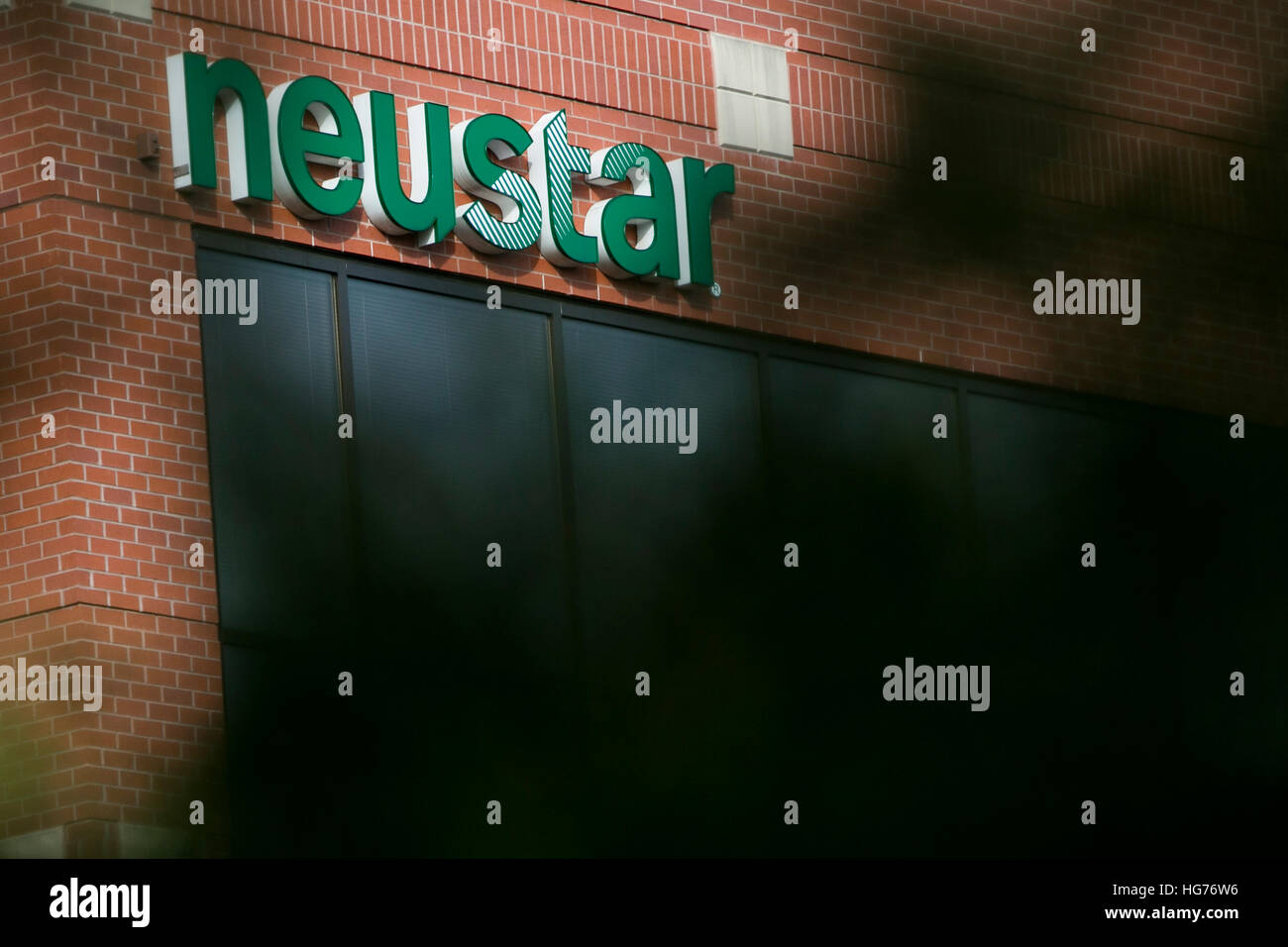 A logo sign outside of the headquarters of Neustar, Inc., in Sterling ...