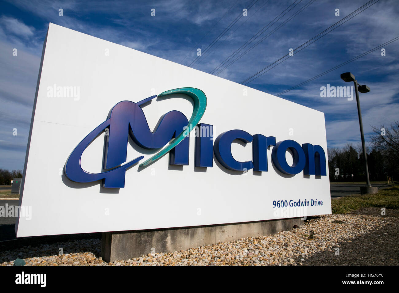 A logo sign outside of a facility occupied by Micron Technology Inc ...