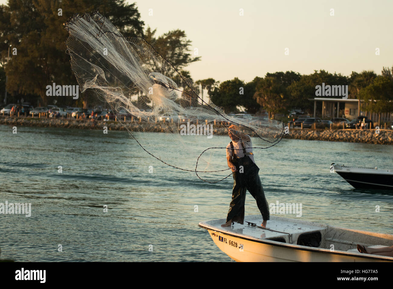 Fisherman casting fishing net hi-res stock photography and images - Alamy