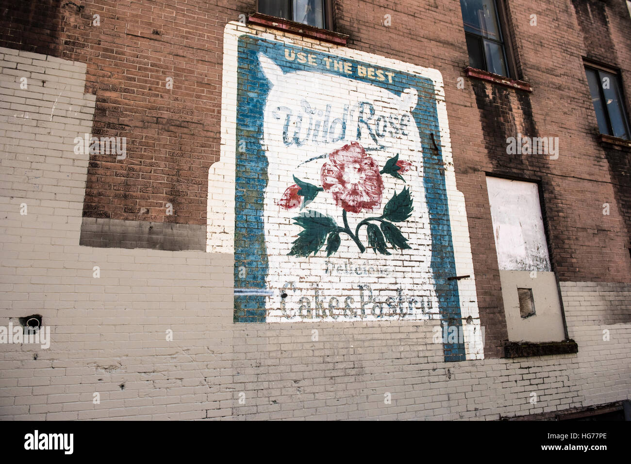Old billboard ad painted on a brick building Stock Photo - Alamy