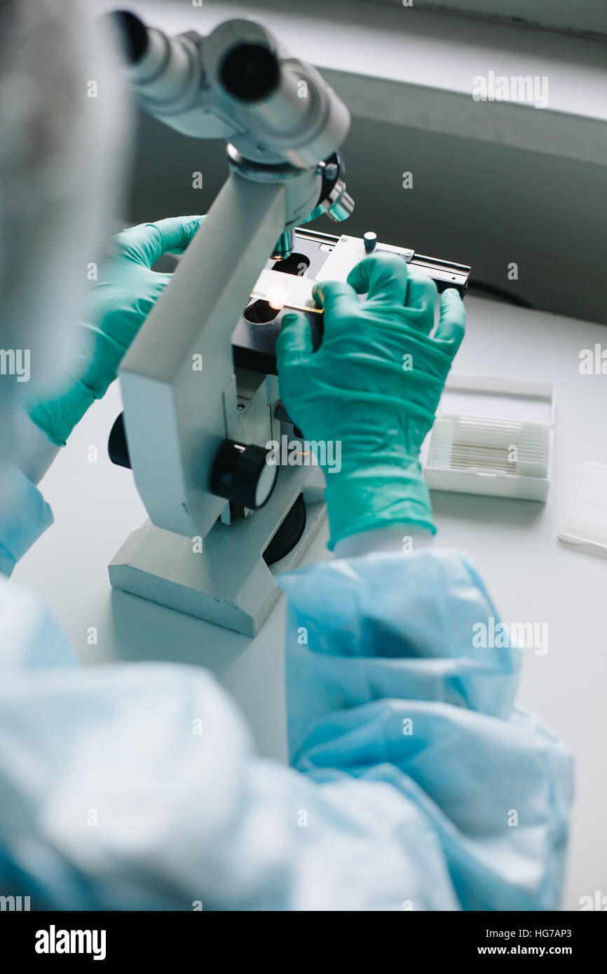 Crop hands putting microscope glasses in box Stock Photo - Alamy