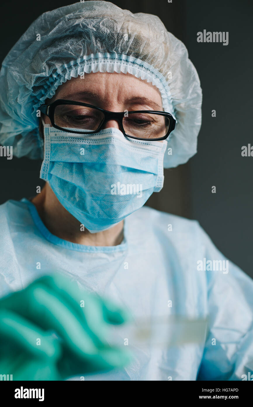 Crop hands putting microscope glasses in box Stock Photo - Alamy