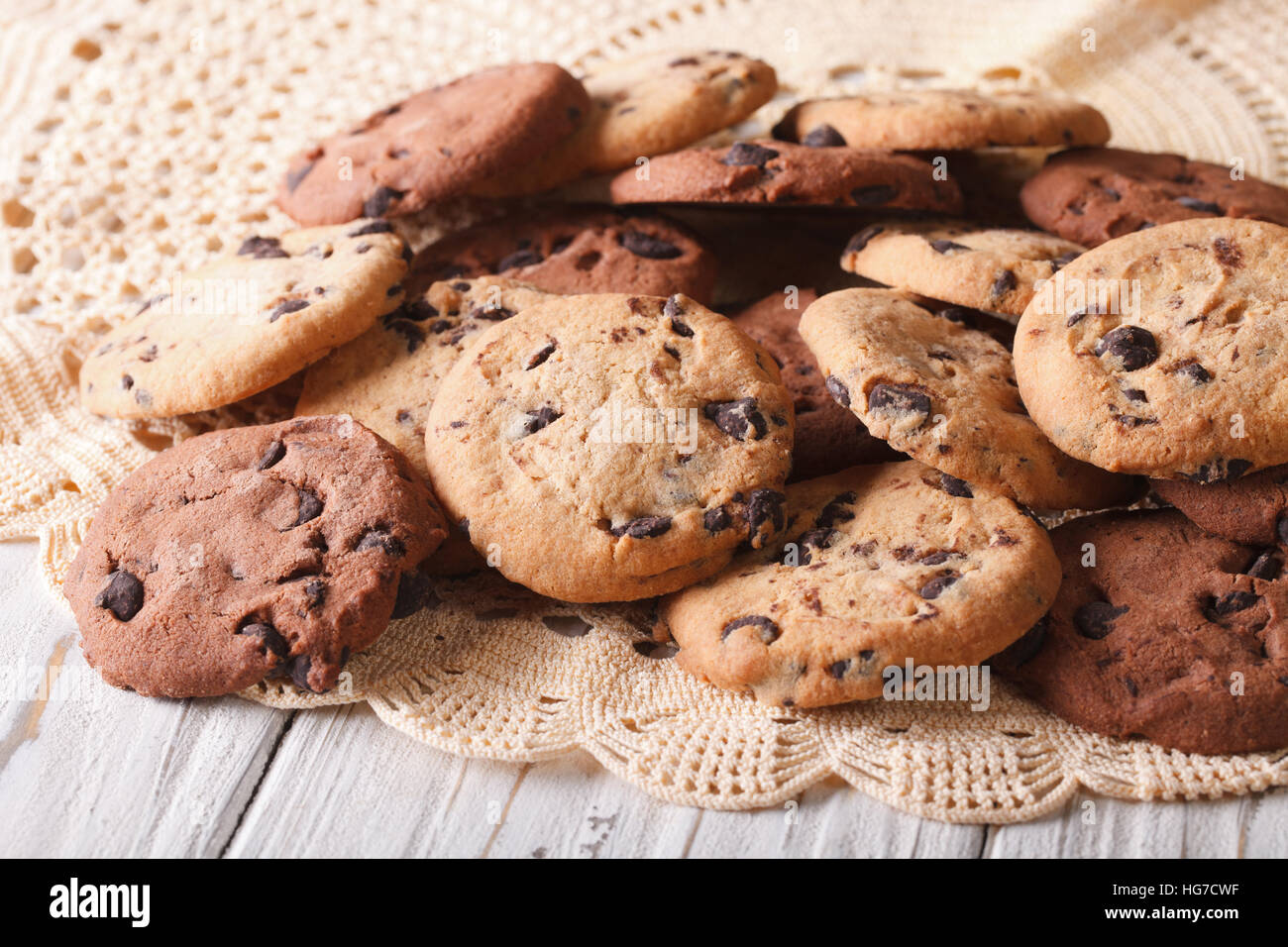 homemade chocolate chips cookies close-up on a lace doily. horizontal ...