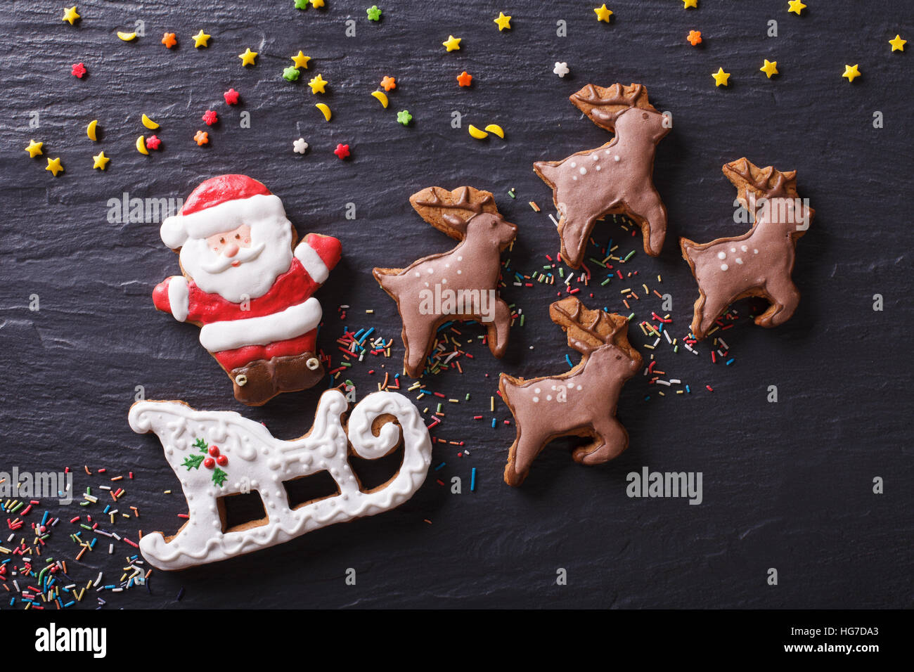 Gingerbread Santa on a sleigh pulled by reindeers. horizontal view from ...