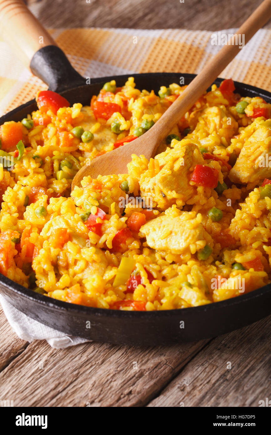 Hispanic rice with chicken and vegetables close-up in a frying pan on ...