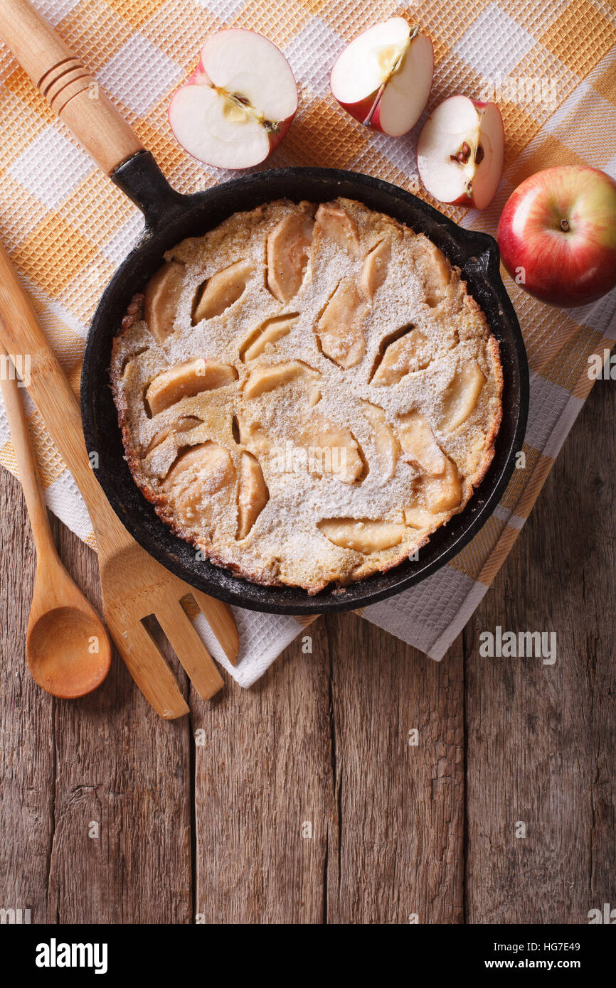 Dutch baby pancake with apples in a pan. vertical view from above Stock ...