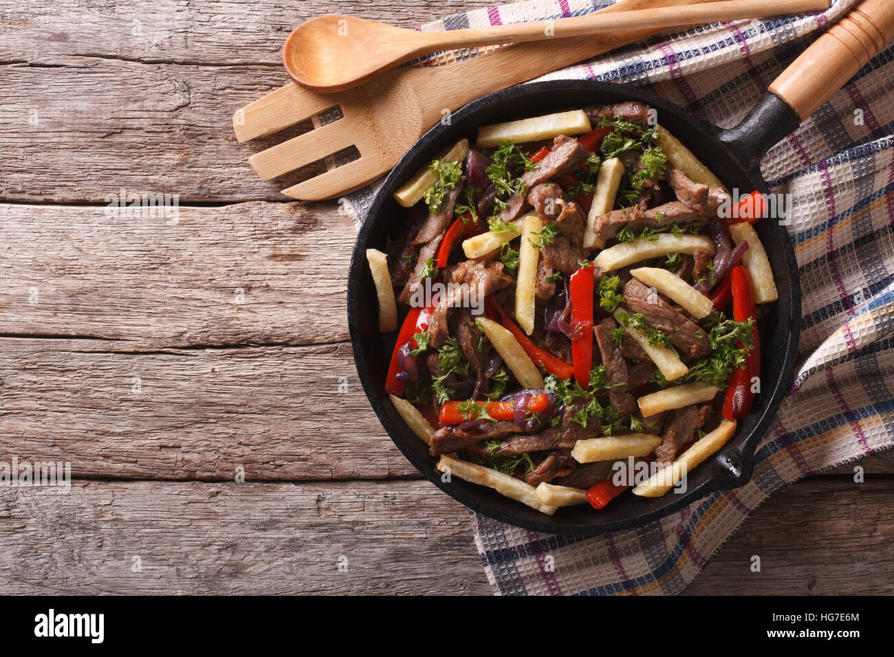 Homemade Peruvian Food: Lomo saltado in a frying pan. horizontal view ...
