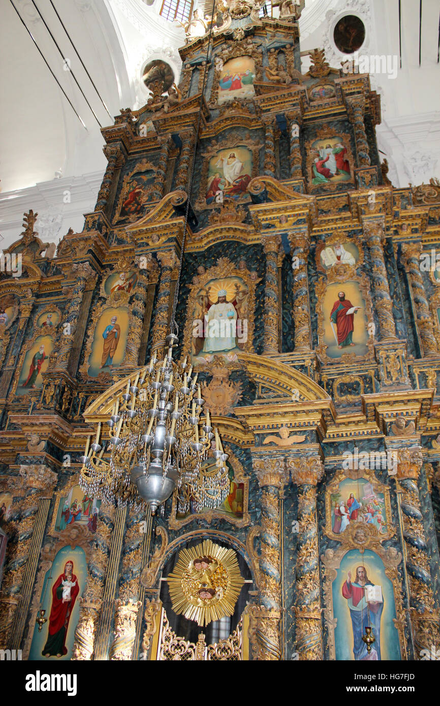 beautiful iconostasis with ancient icons set in wooden frame. Religious work of art in the ...