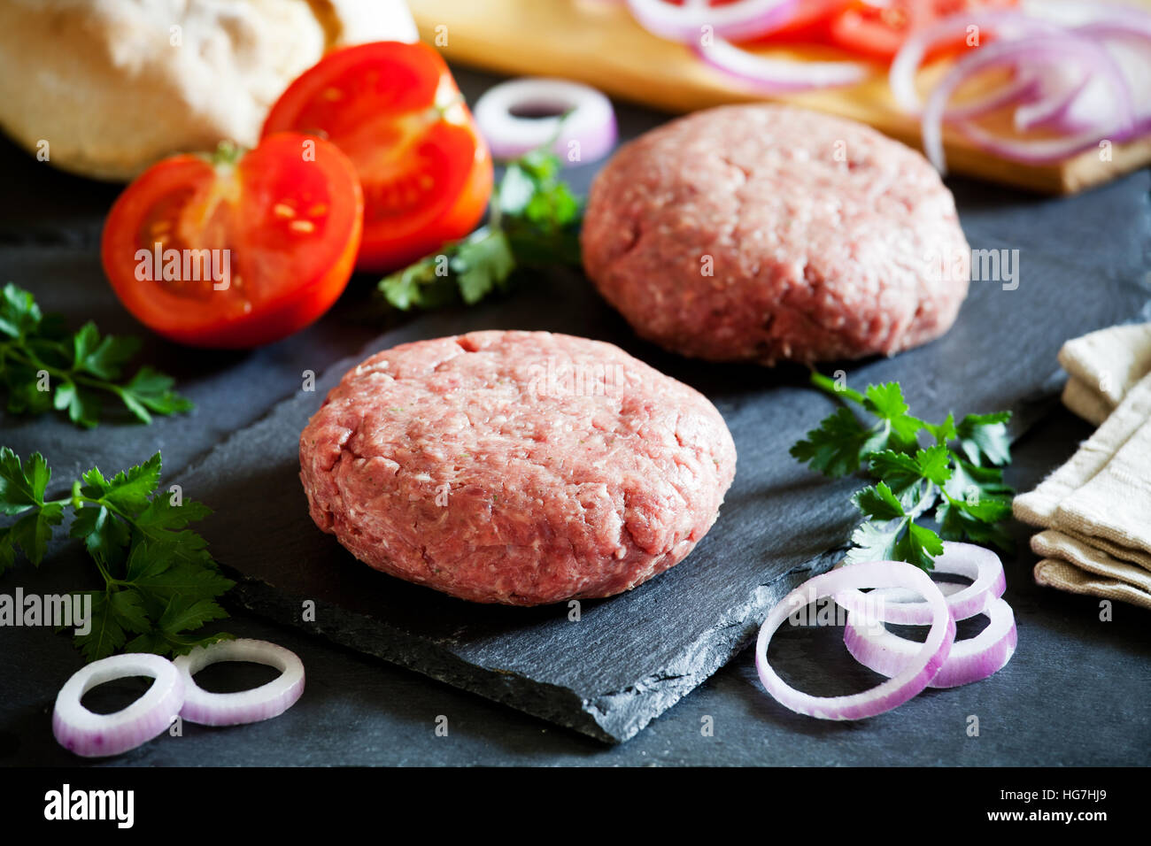 Raw meat patties parsley hi-res stock photography and images - Alamy