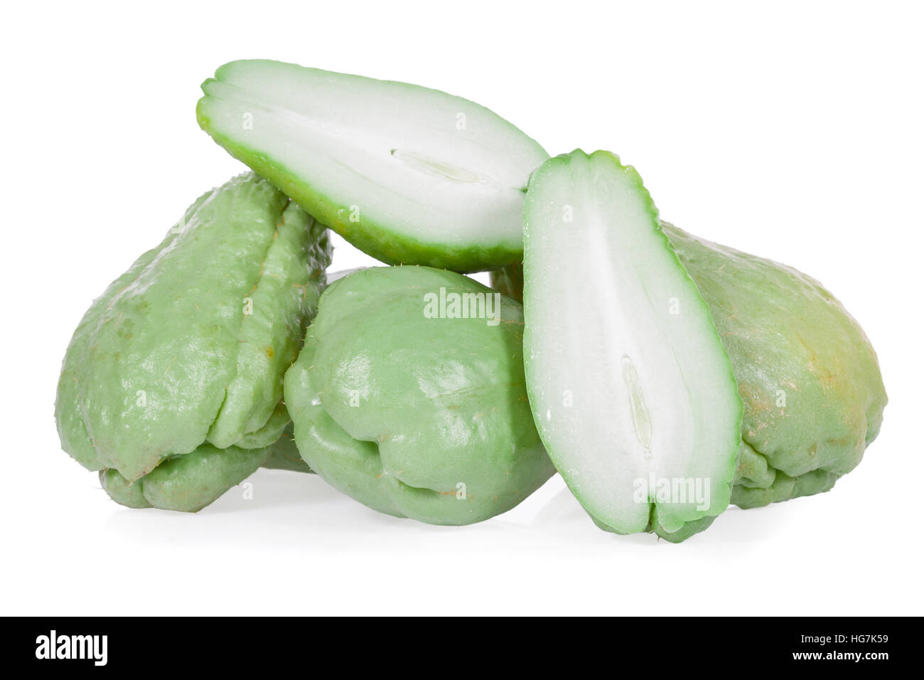 Chayotes isolated on white background, with one Chayote cut in half ...