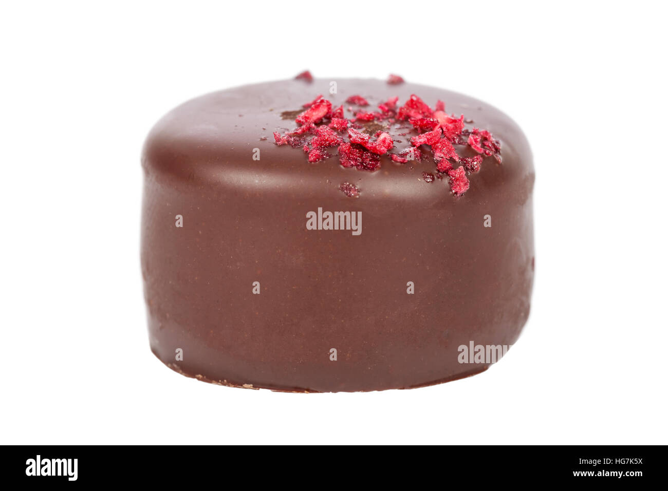 Gourmet bonbon, aka bon-bon or truffle made of dark chocolate. Closeup ...