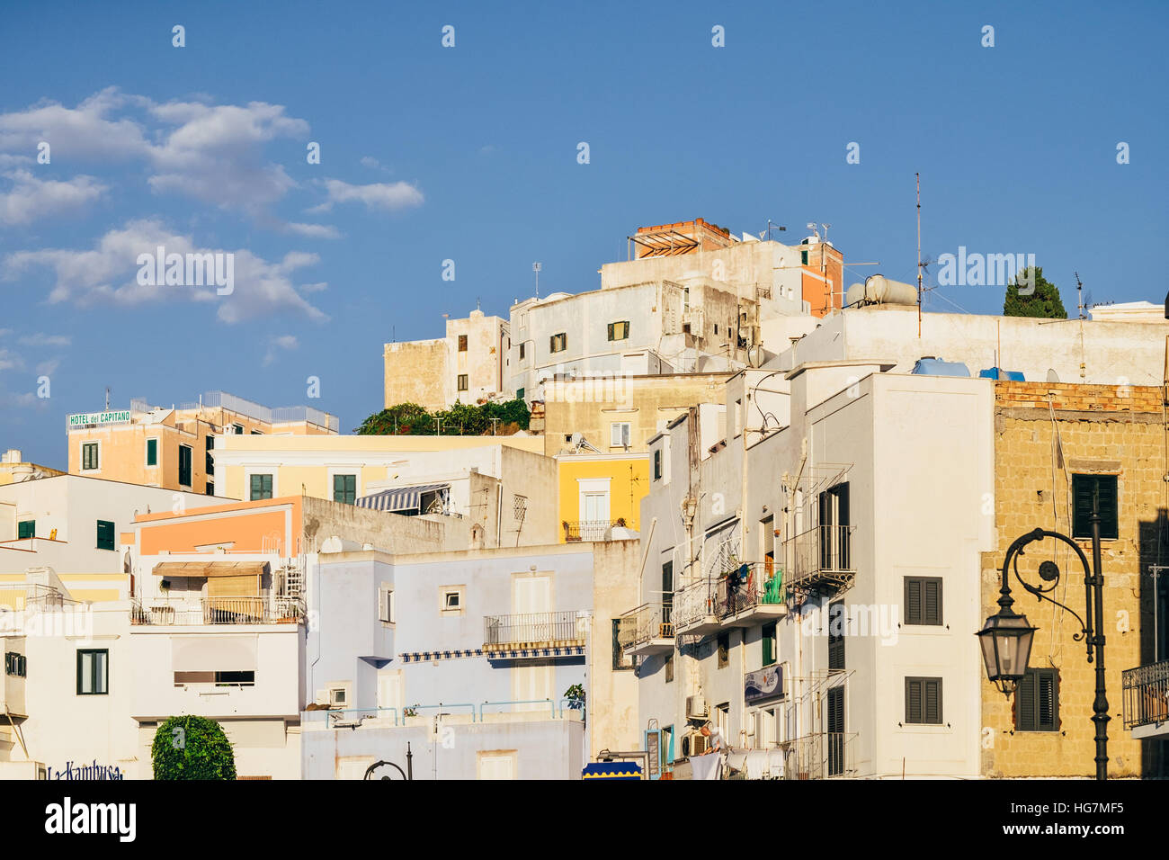 Golden evening light illuminates the town of the island of Ponza, Italy ...
