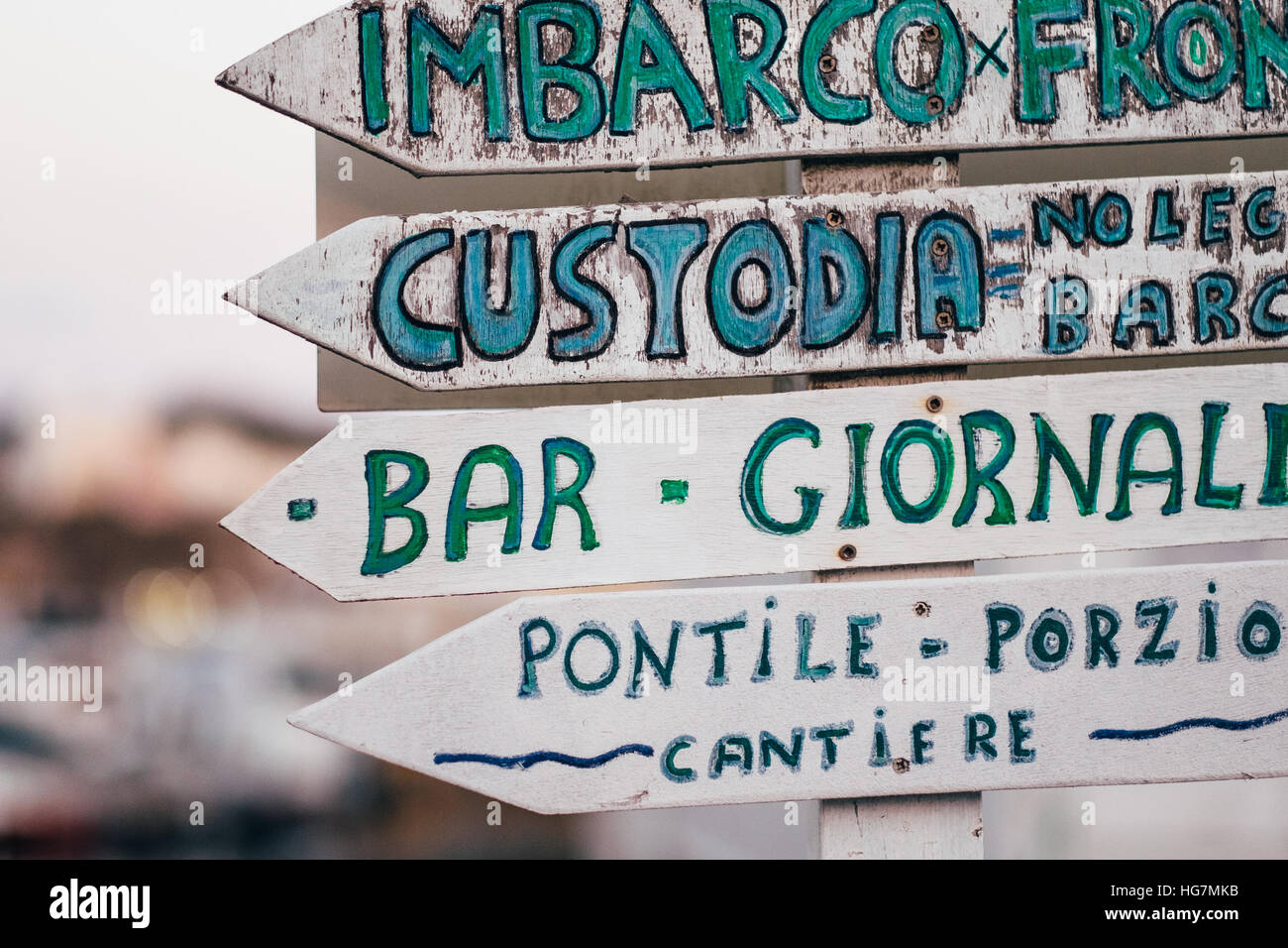 Hand-painted arrow signs give directions on the island of Ponza, Italy ...