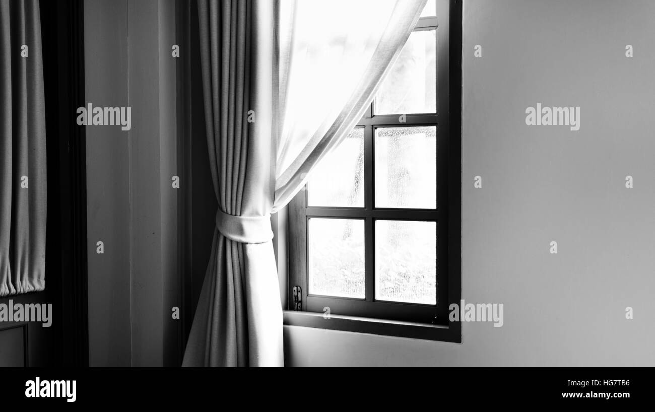 Simple window with white curtain Stock Photo - Alamy