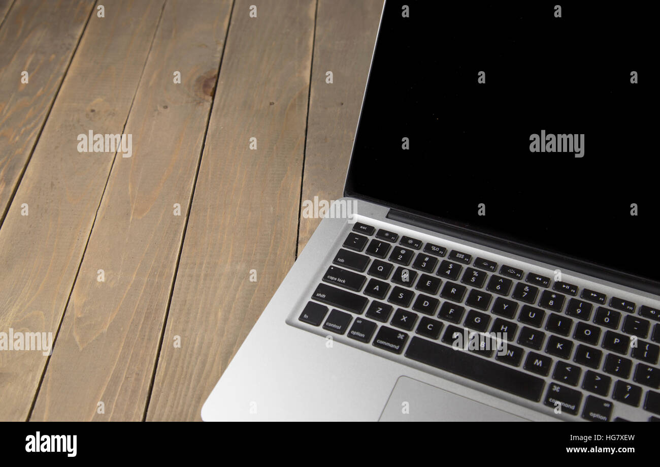 laptop on wood background Stock Photo - Alamy