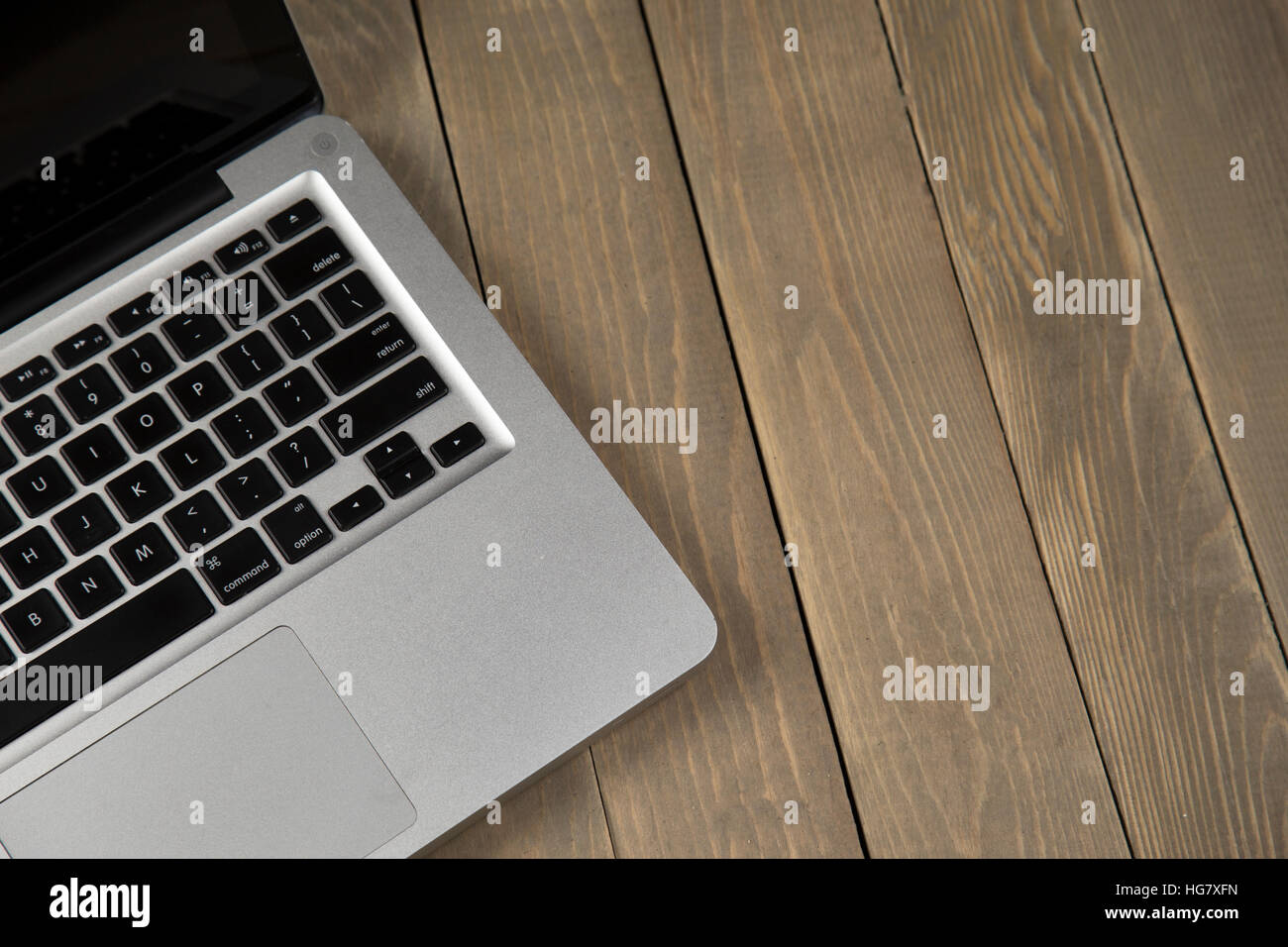 laptop on wood background Stock Photo - Alamy