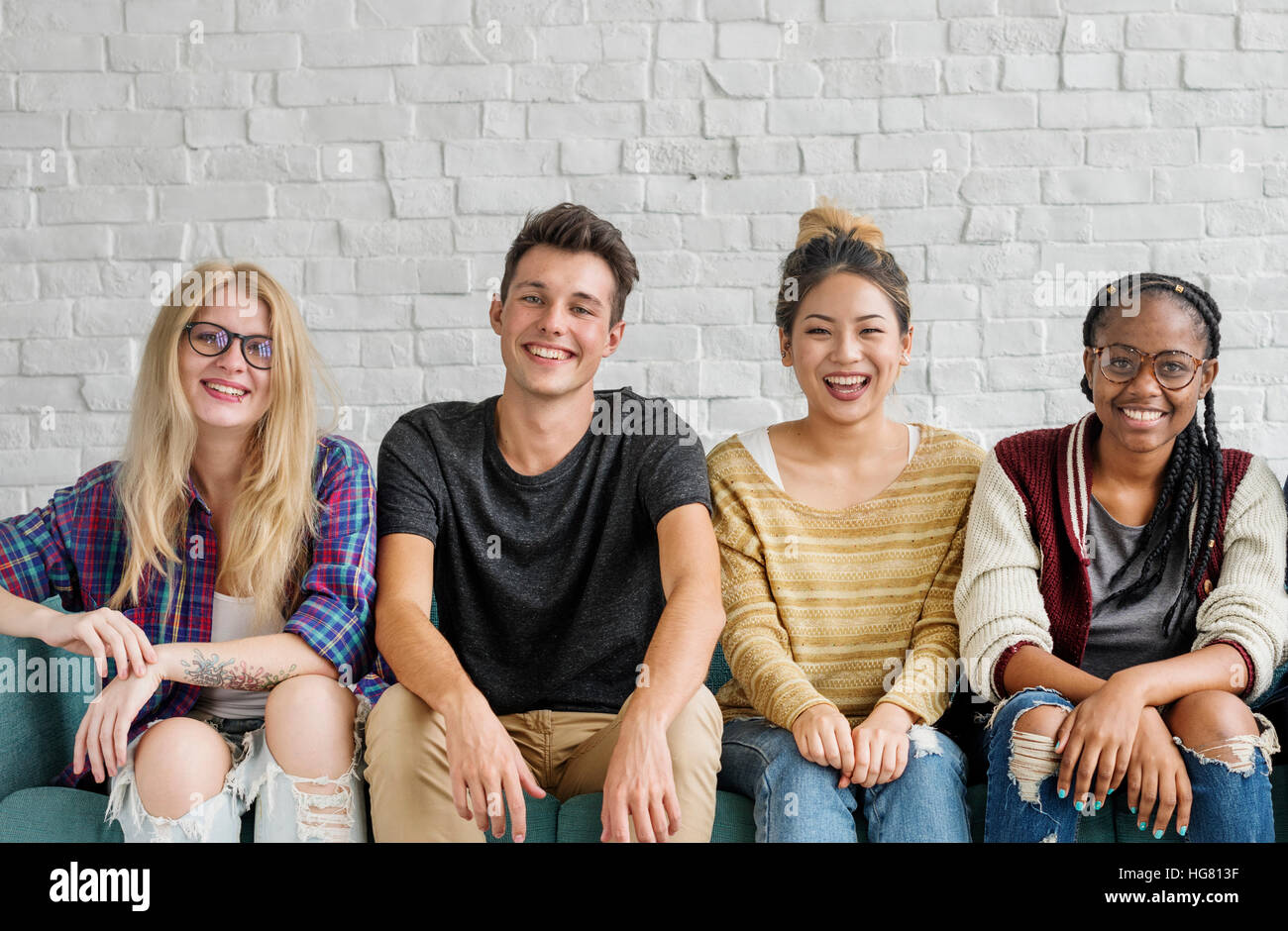 Diverse group people sitting couch hi-res stock photography and images ...