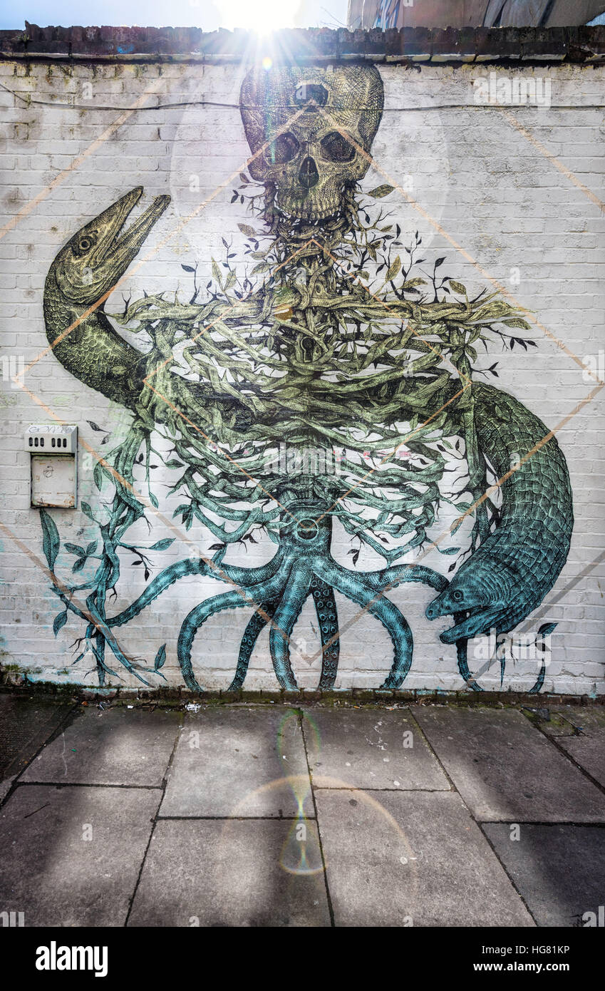 Street art mural of a Skeleton made of eels and an octopus on a wall in ...