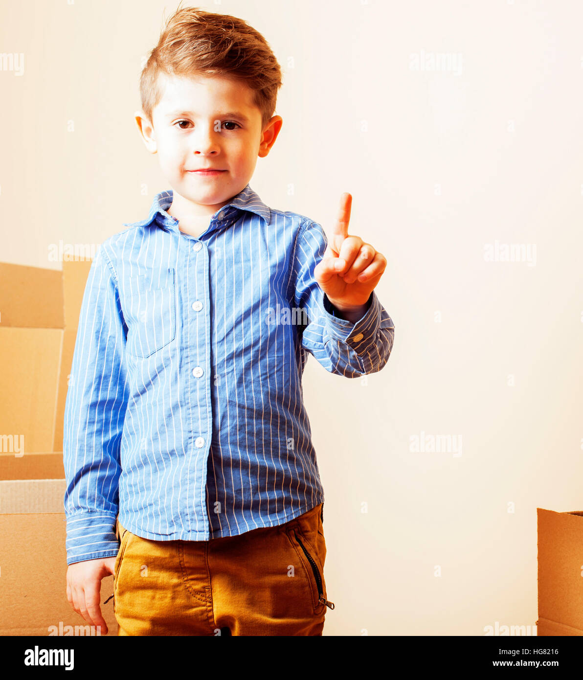 little cute boy in empty room, remoove to new house. home alone Stock ...