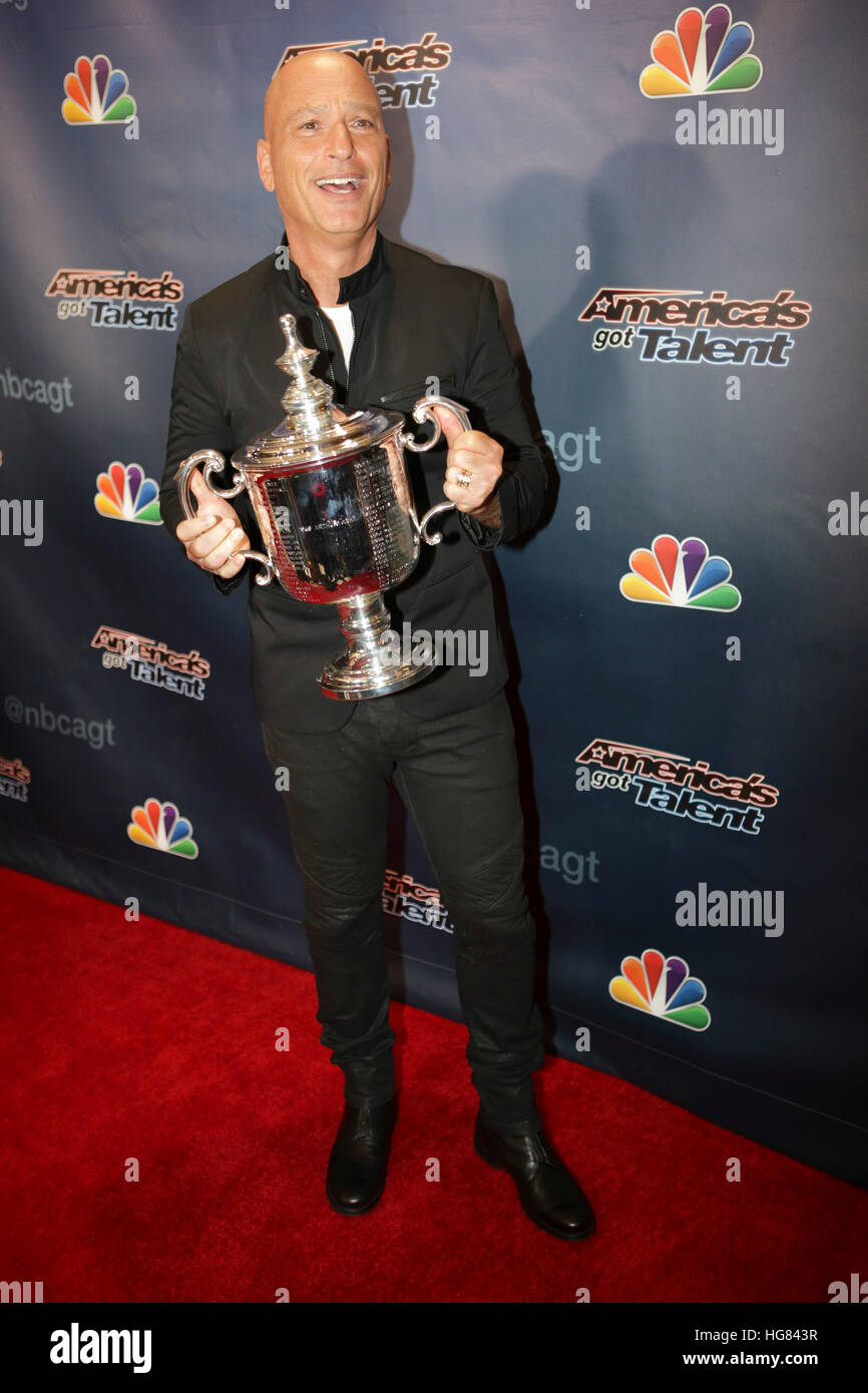 Howie Madel poses with the U.S. Open trophy as he arrives at the ...