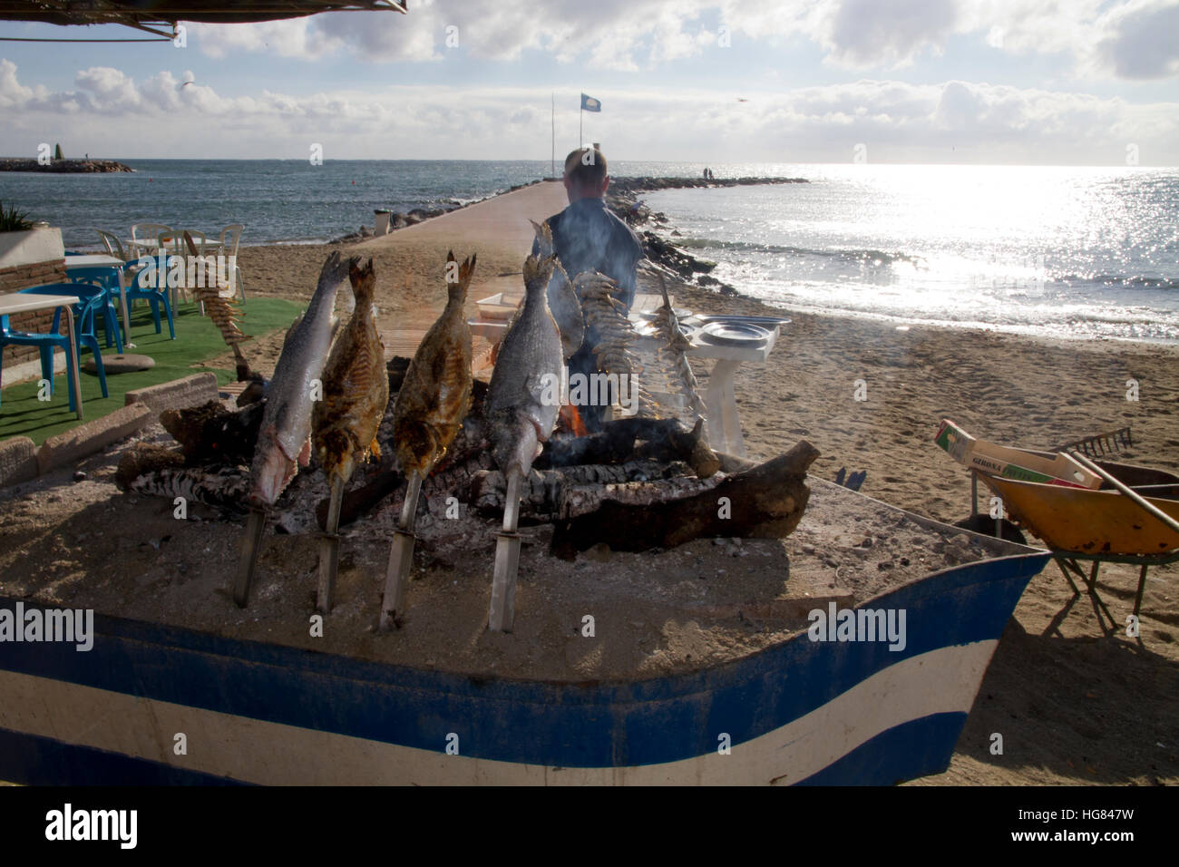 Fresh fishes cooking on beach BBQ in Marbella, Costa del Sol, Andalucia ...