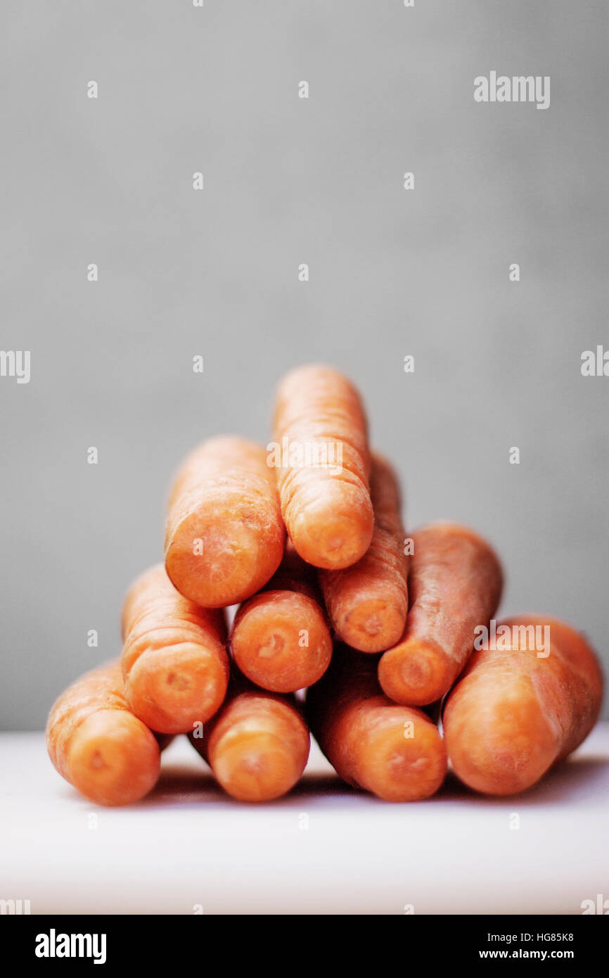 Stack of carrots on table Stock Photo - Alamy