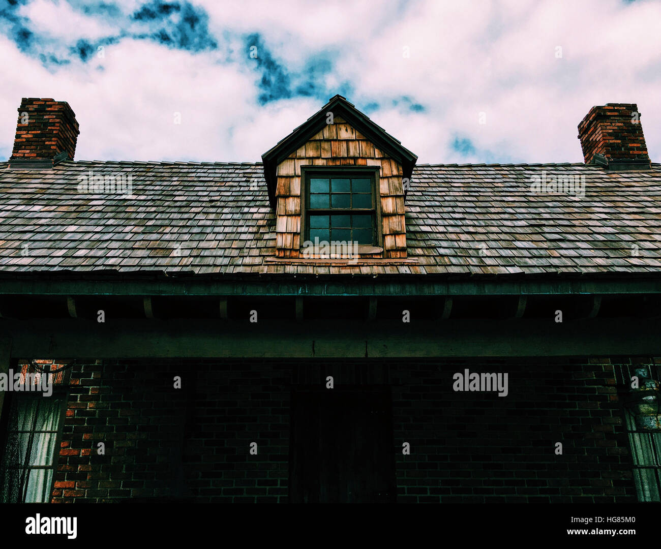 House with cloudy sky hi-res stock photography and images - Alamy