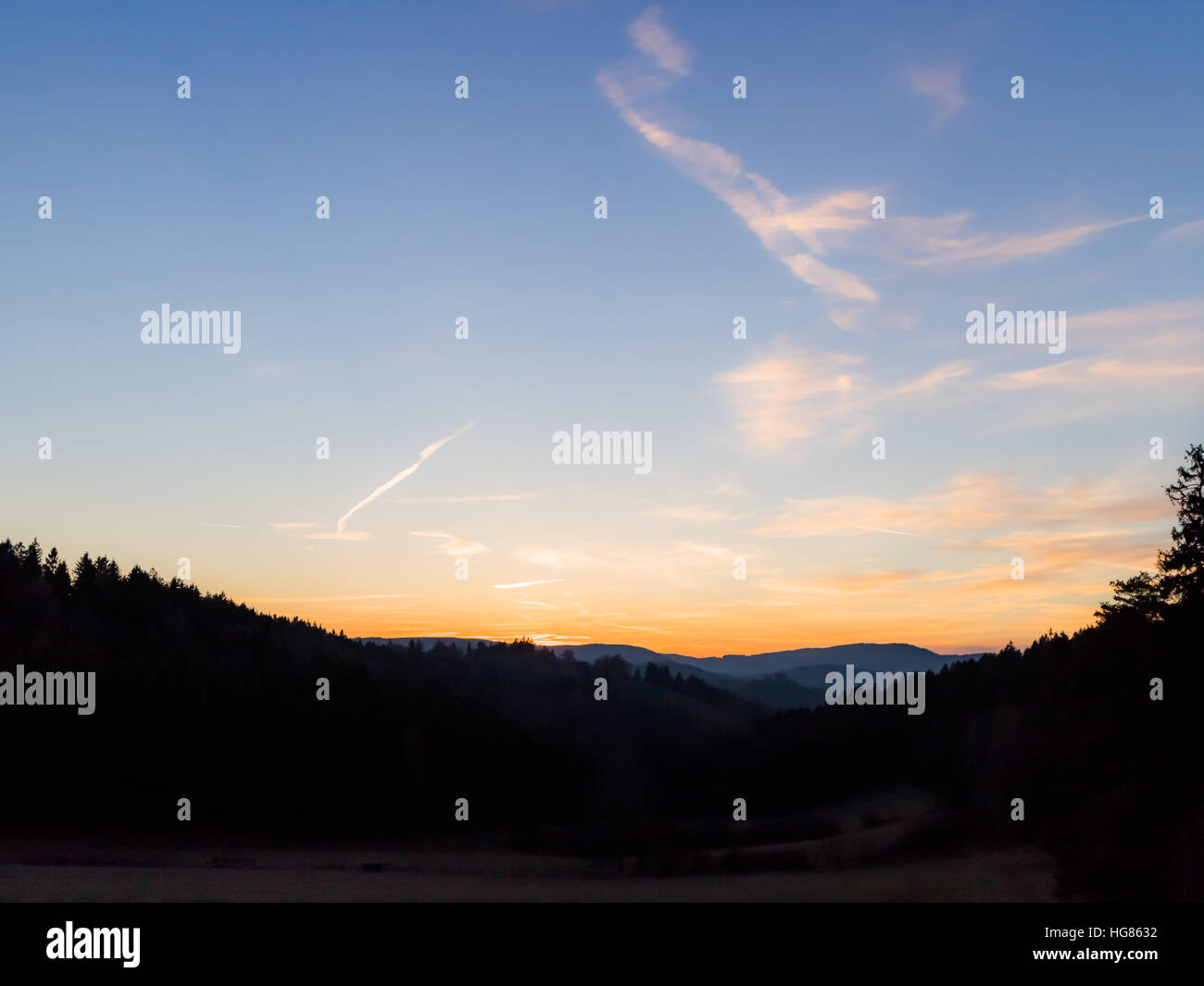 Sunset in the hills Stock Photo - Alamy