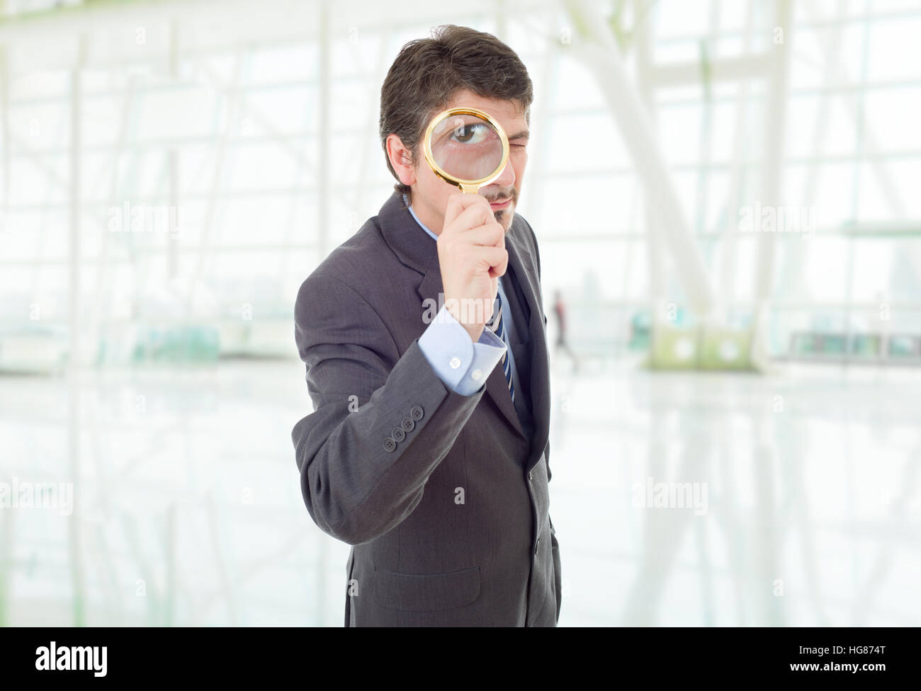business man with magnifying glass at the office Stock Photo - Alamy