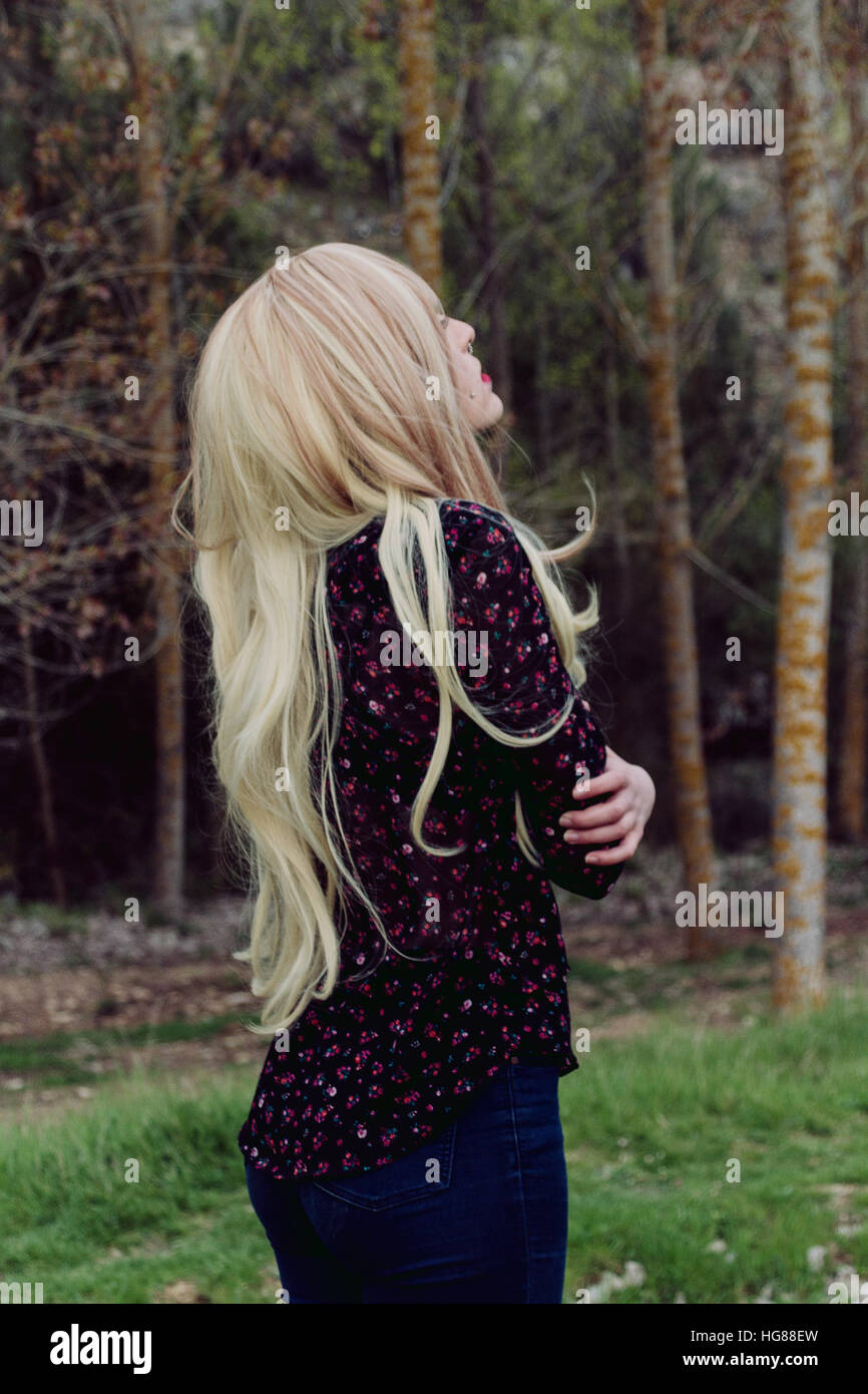 Woman hugging herself sad hi-res stock photography and images - Alamy