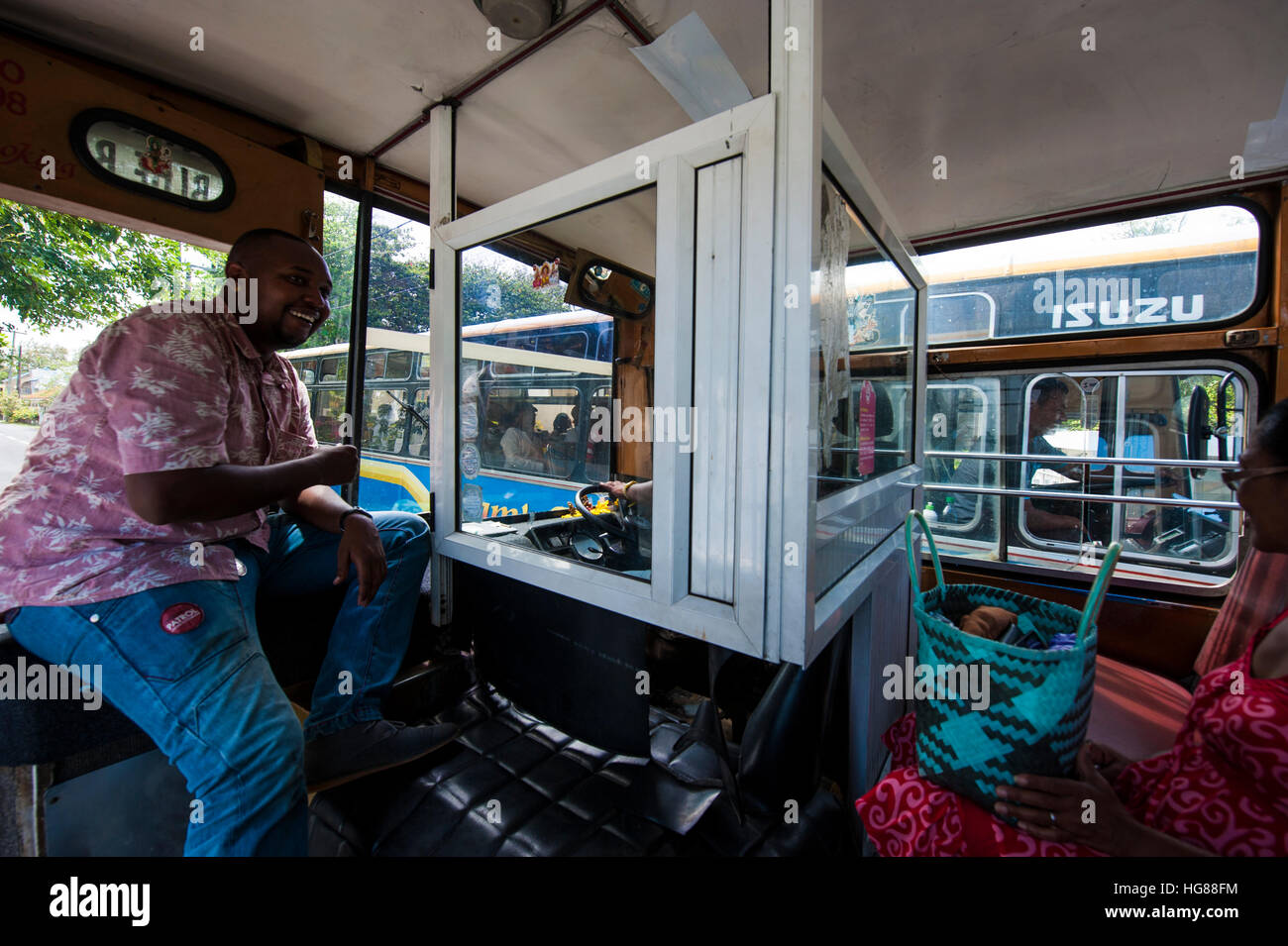 Public transport in Mauritius Island. Bus drivers stop in the middle of ...