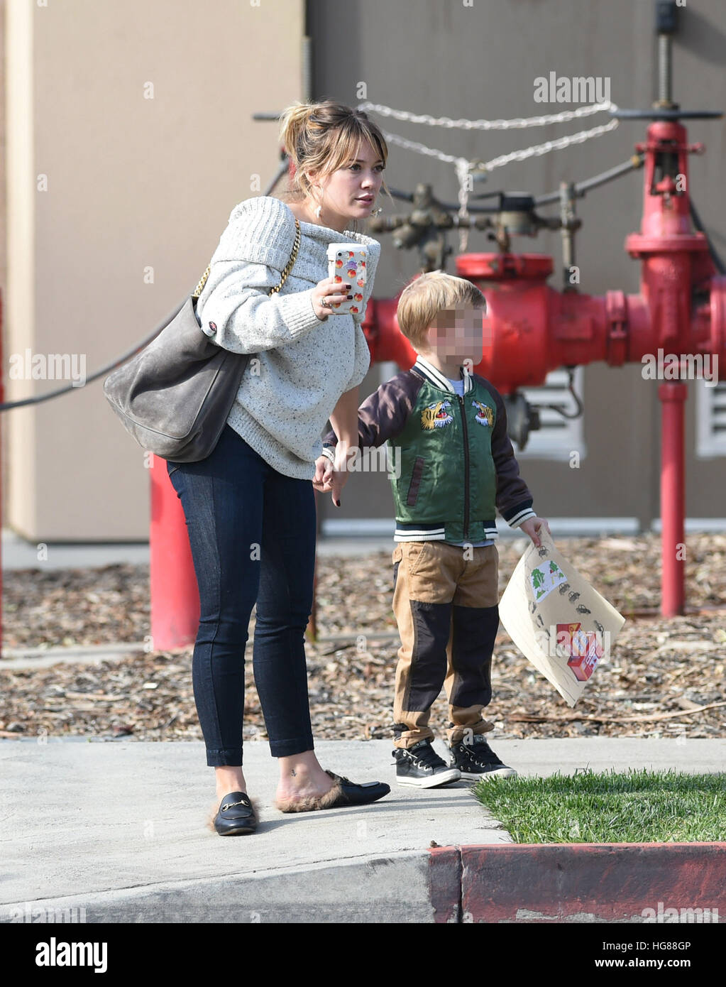 Hilary Duff has fun with her son Luca Comrie at a demonstration by the Los Angeles Fire ...