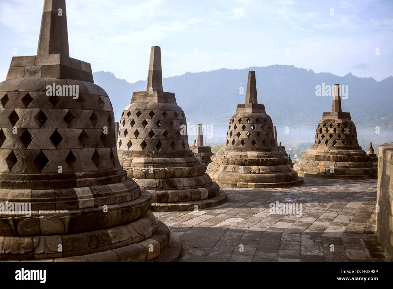 Stupas at Prambanan temple against mountains=-= Stock Photo - Alamy