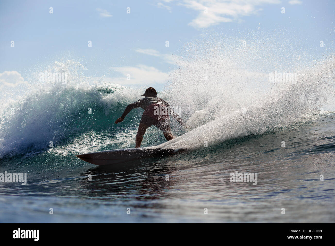 Rear view of man surfboarding in sea Stock Photo - Alamy