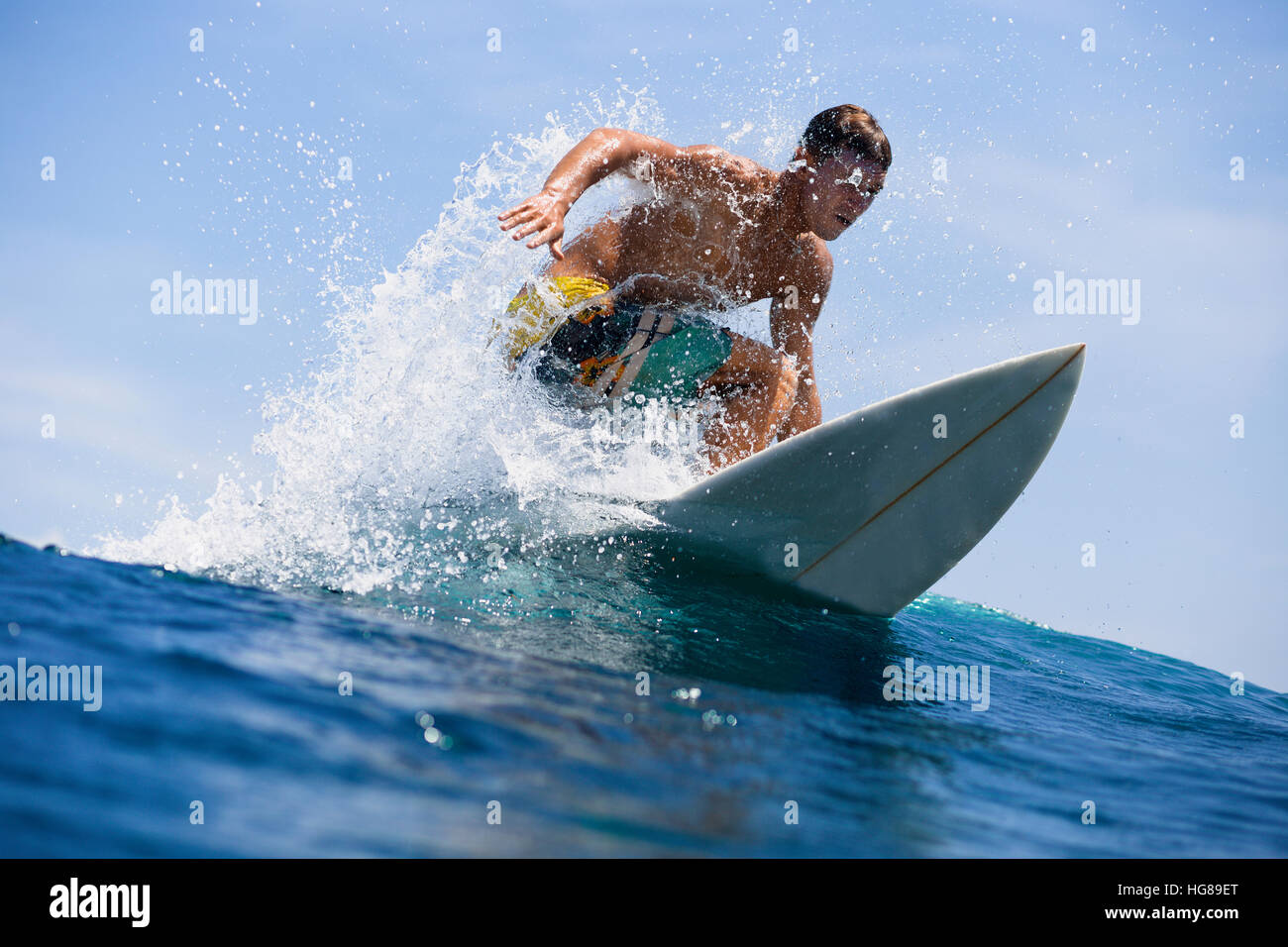 Man surfboarding on wave Stock Photo - Alamy
