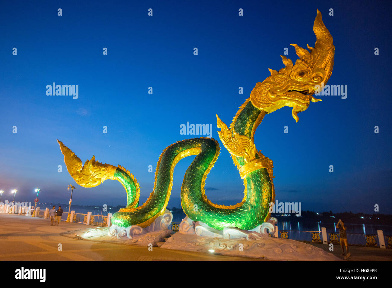 a Phayanak or Naga Statue at the mekong river in the town of Nong Khai ...