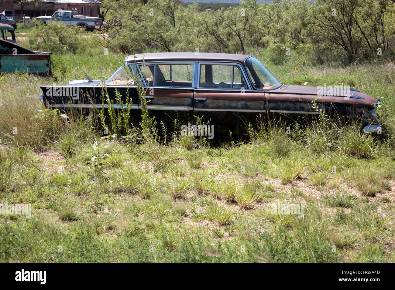 Abandoned vehicle in a yard Stock Photo - Alamy
