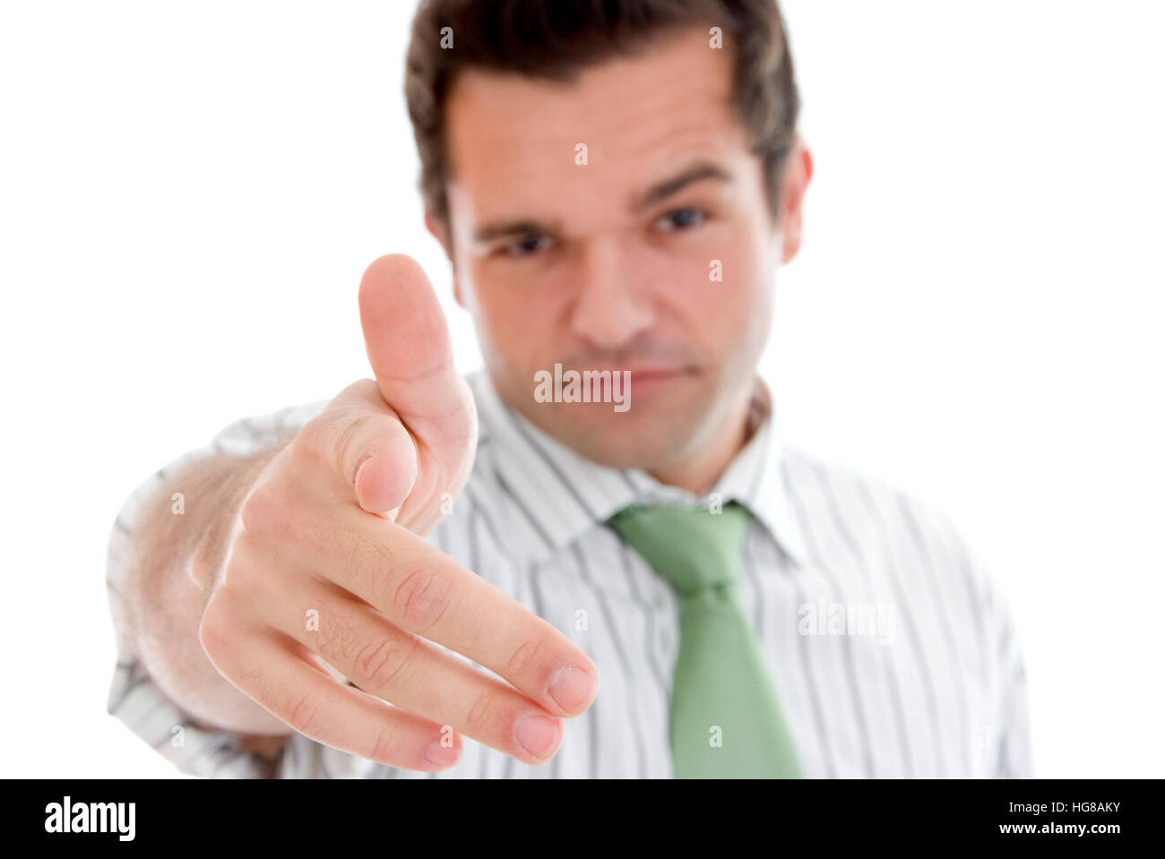 Young businessman points a finger Stock Photo - Alamy