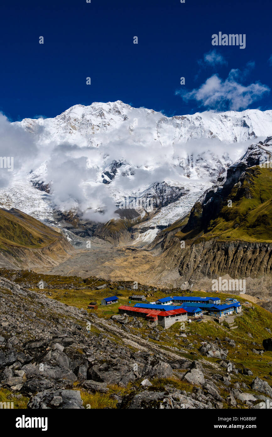 Houses of Annapurna Base Camp, glacier and the snow covered Annapurna 1 ...