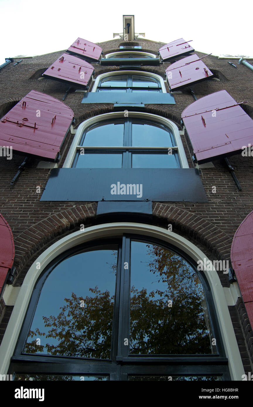Amsterdam canal house windows Stock Photo - Alamy