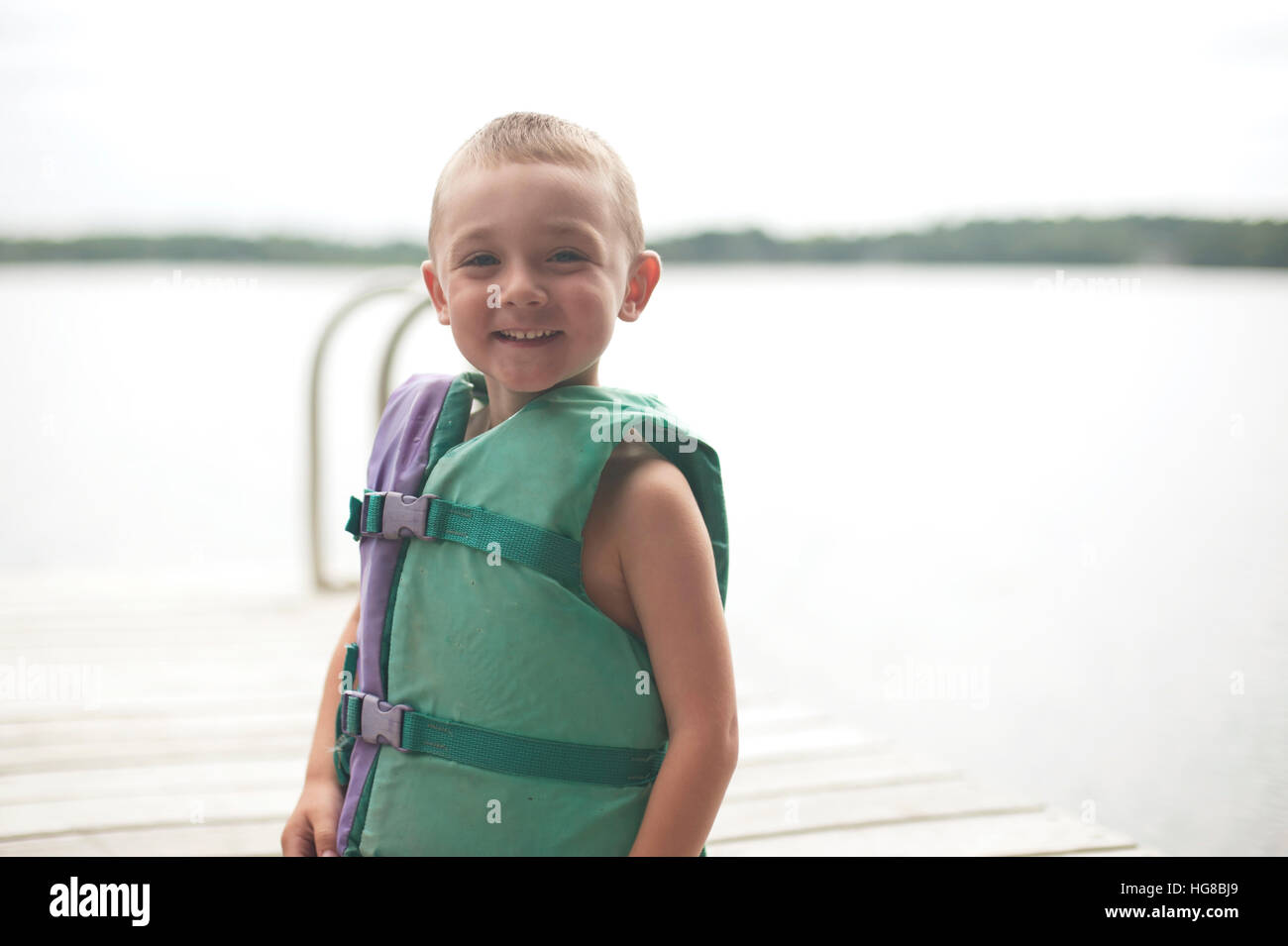 Boy on jetty hi-res stock photography and images - Alamy