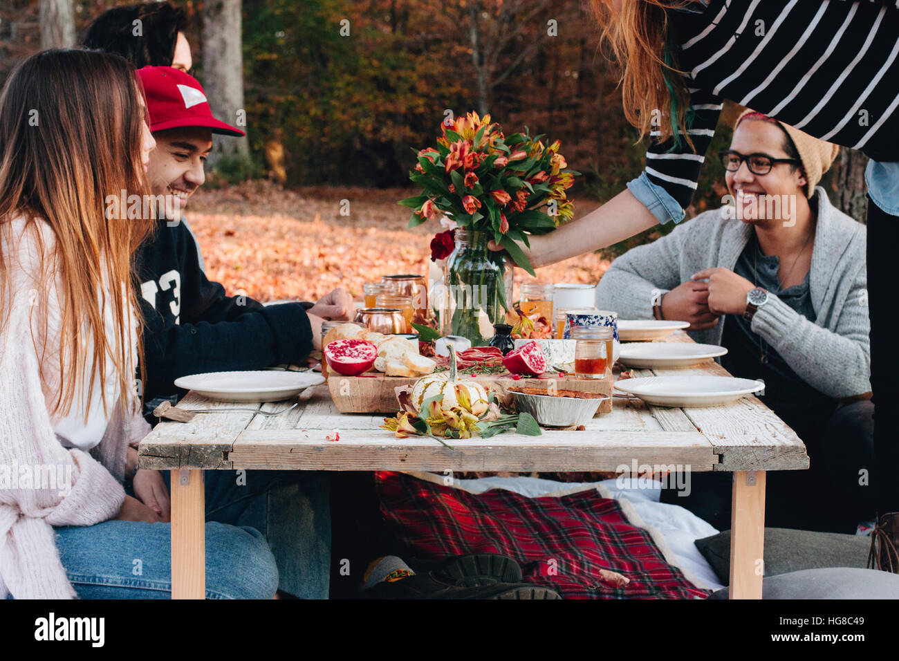 Adults sitting at picnic table hi-res stock photography and images - Alamy