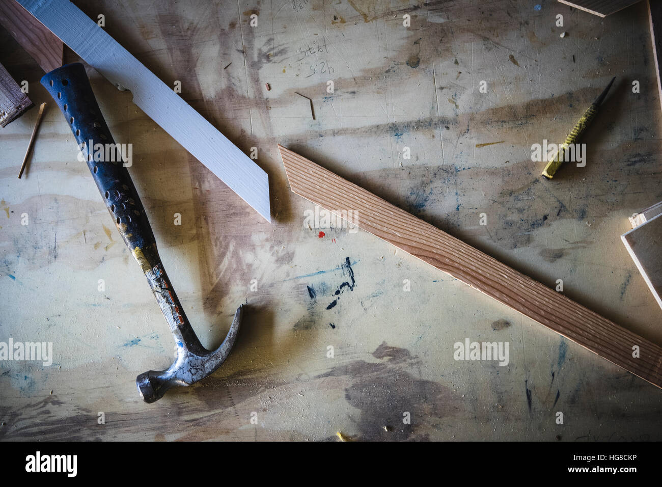 Overhead view of hammer and wood on workbench in workshop Stock Photo ...