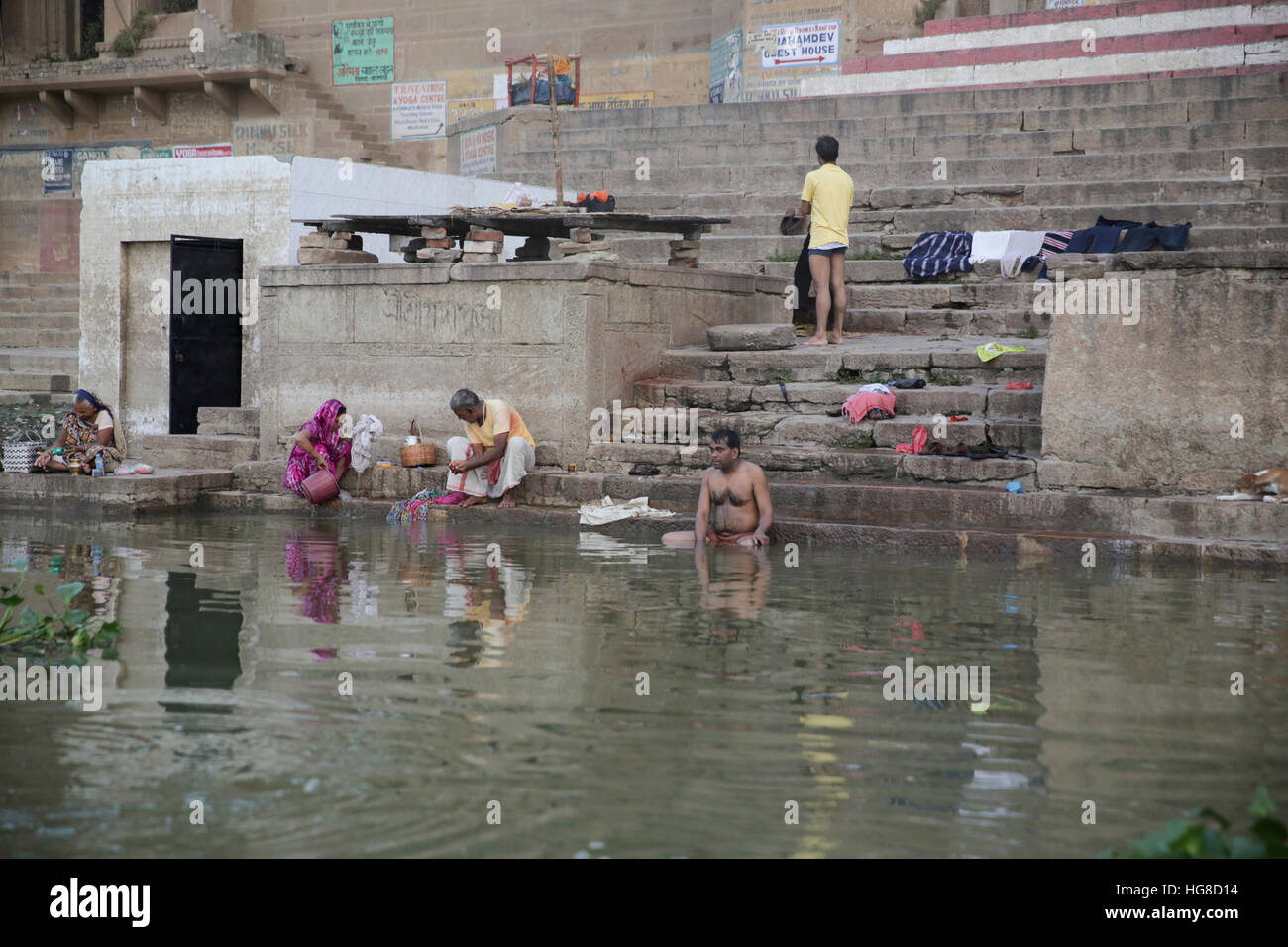 People bathing and washing clothes in river by steps Stock Photo - Alamy
