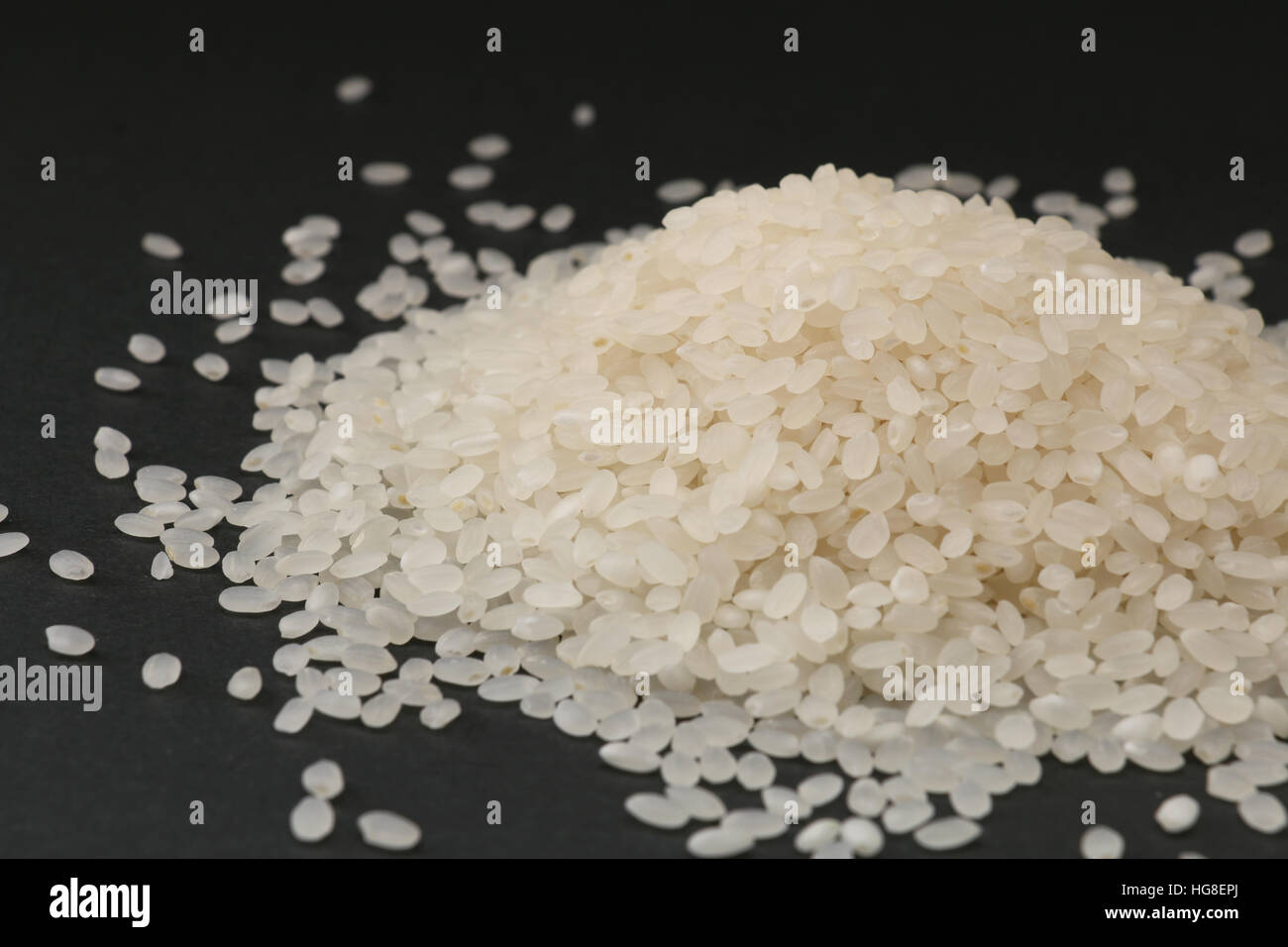 Japanese white grain rice on black Stock Photo - Alamy