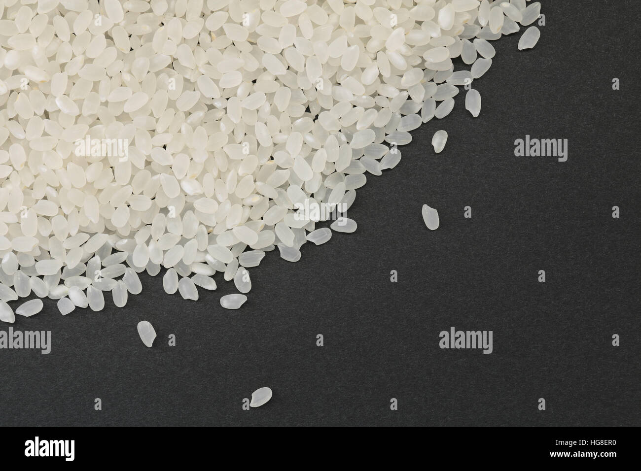 Japanese white grain rice on black #2 Stock Photo - Alamy
